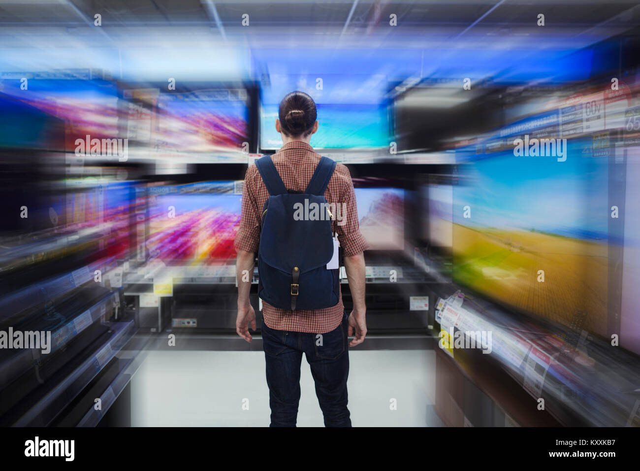 A tourist in a supermarket, a Caucasian man in Tokyo looking around ...