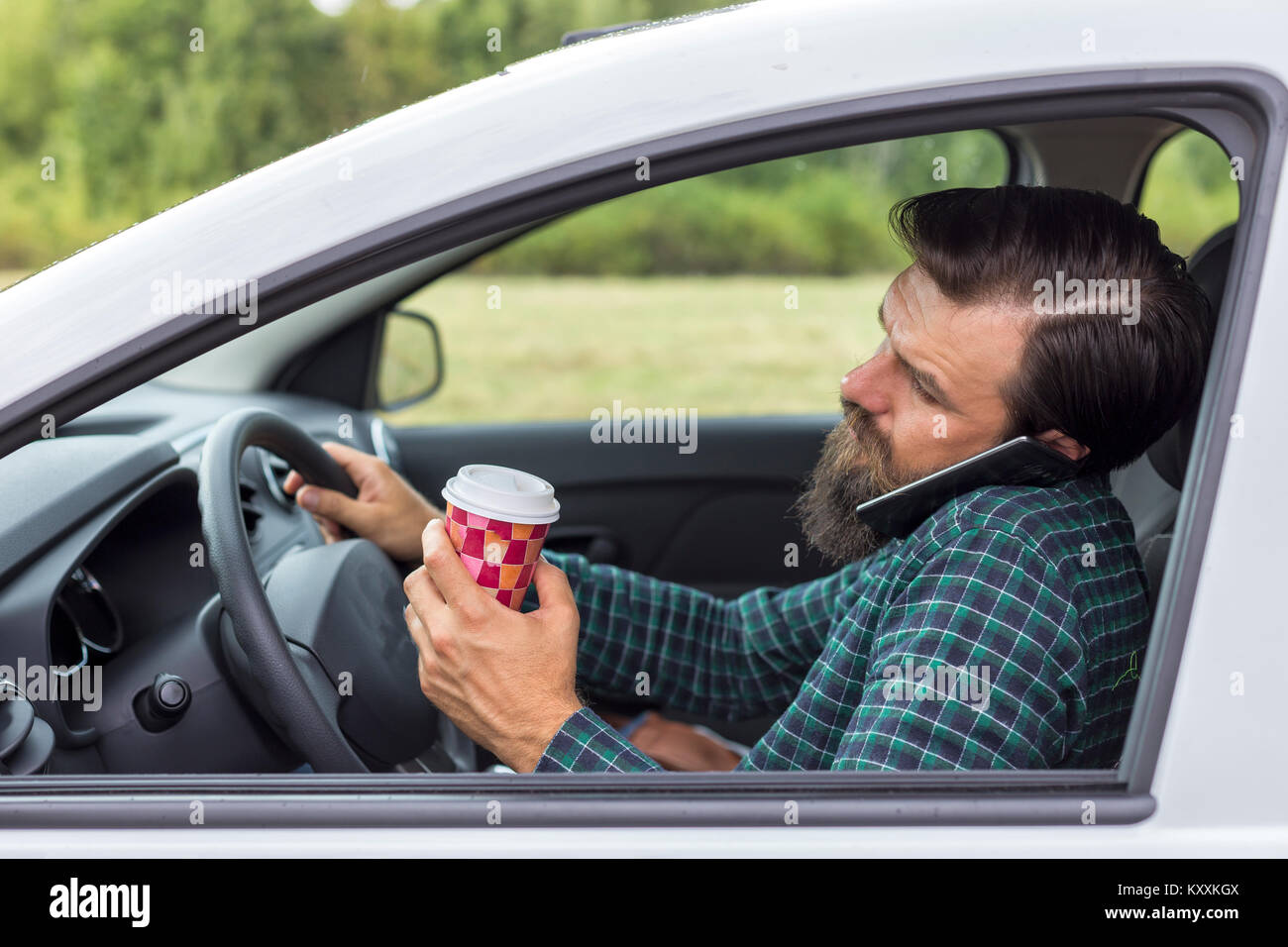 Man drinking coffee driving car hi-res stock photography and images - Alamy