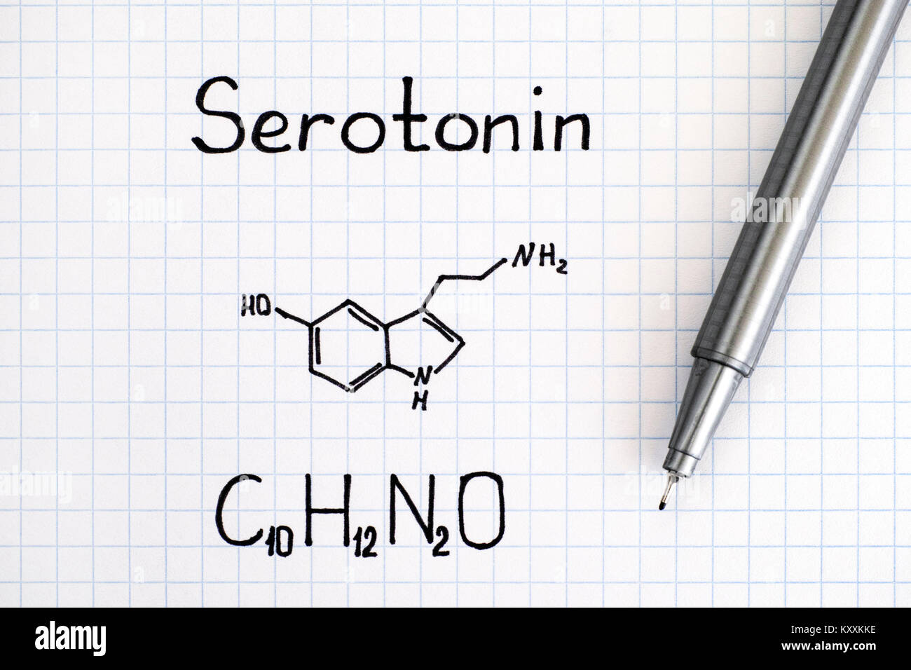 Chemical formula of Serotonin with pen. Close-up Stock Photo - Alamy