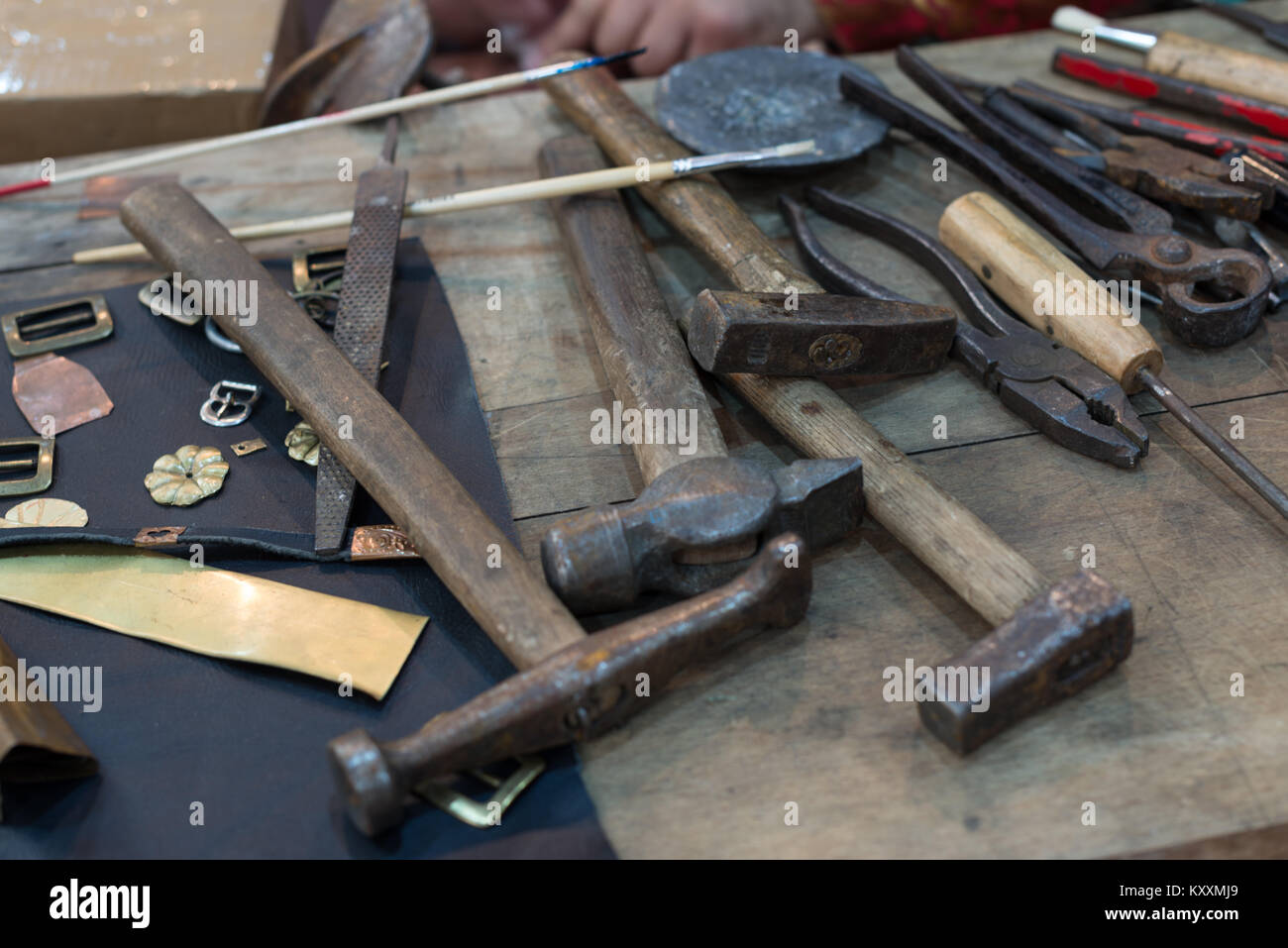 metalsmith tablewith tools in a workshop Stock Photo - Alamy