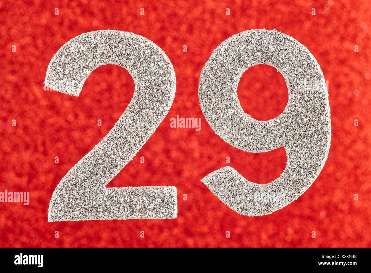 Number twenty-nine silver color over a red background. Anniversary ...