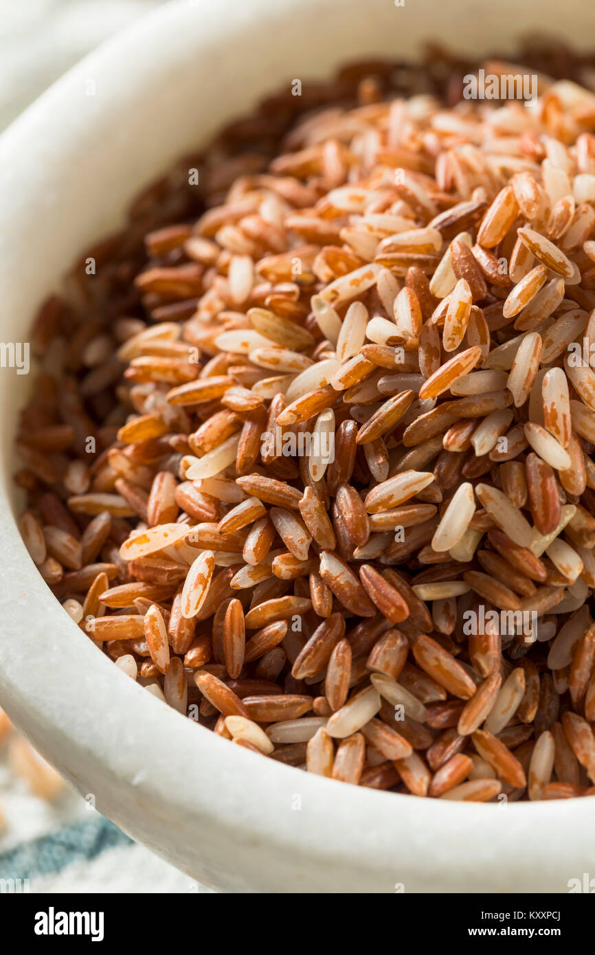 Raw Organic Red Rice in a Bowl Stock Photo - Alamy