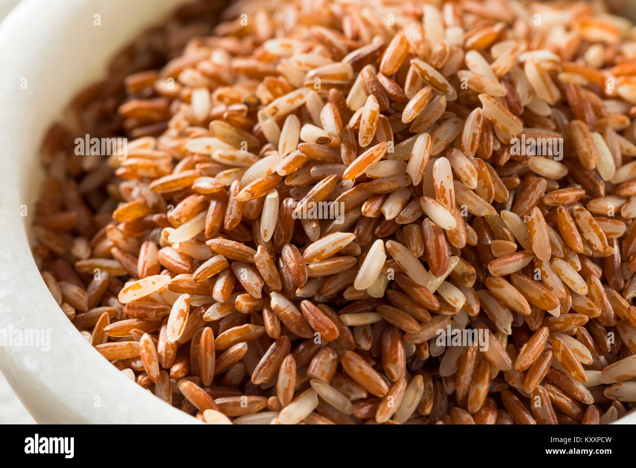 Raw Organic Red Rice in a Bowl Stock Photo - Alamy