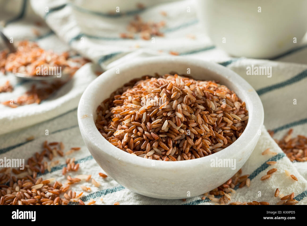 Raw Organic Red Rice in a Bowl Stock Photo - Alamy