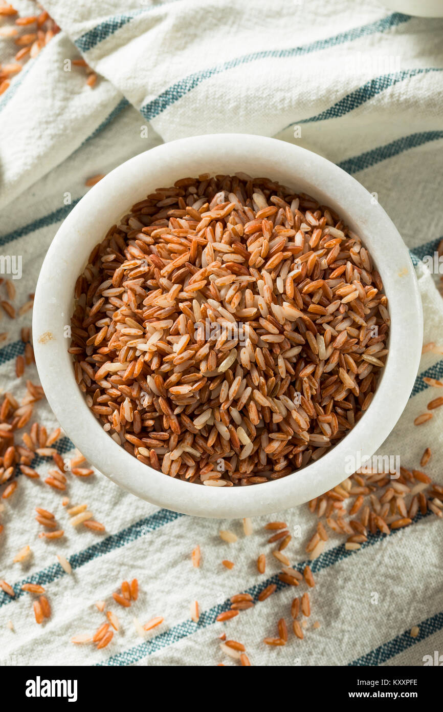 Raw Organic Red Rice in a Bowl Stock Photo - Alamy