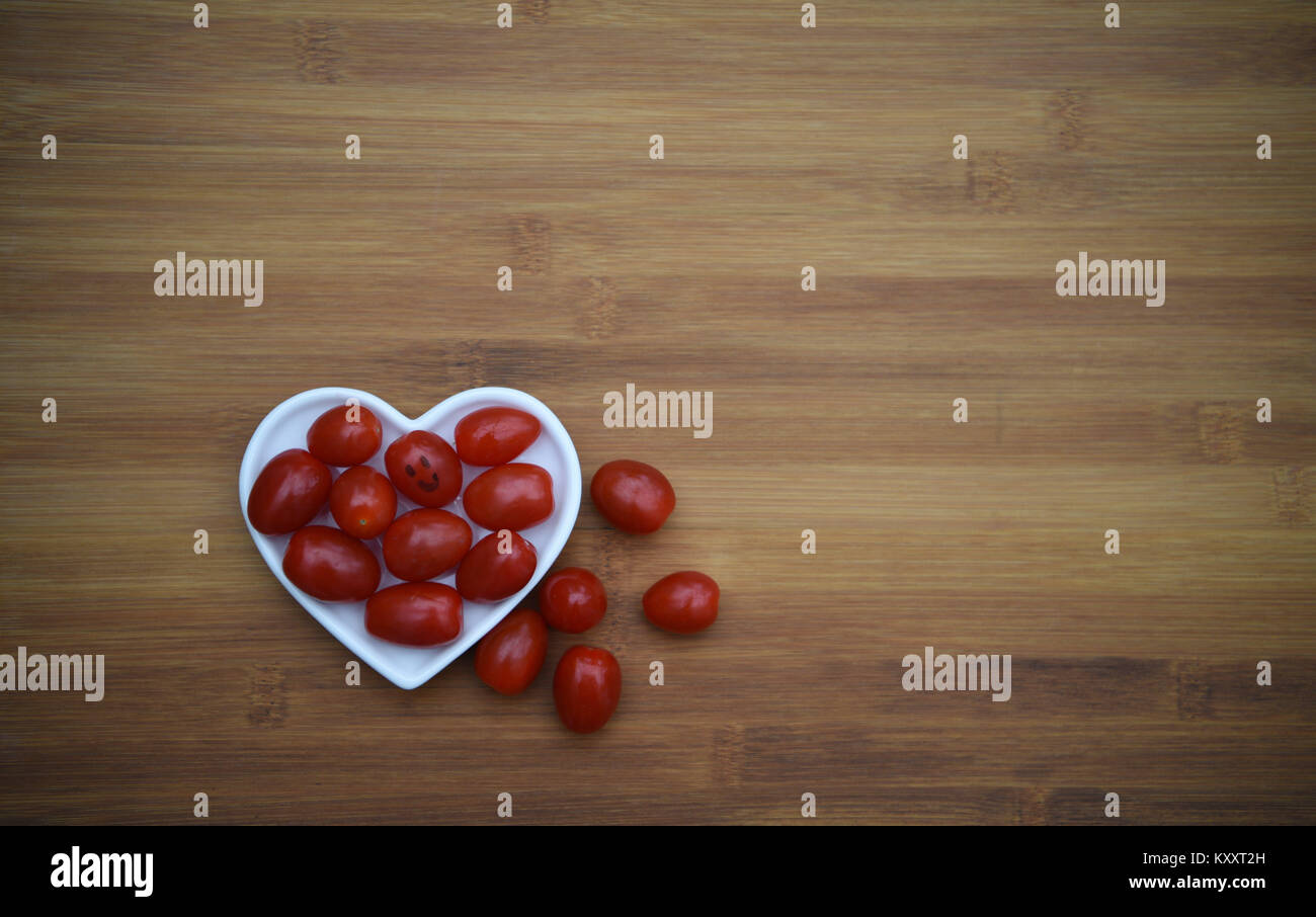 food photography image of healthy red juicy small mini plum tomatoes ...