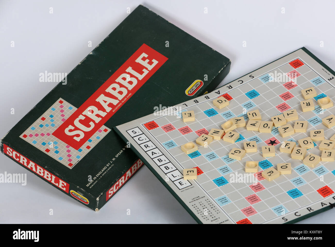 An old Scrabble game pictured shot on a white background in a studio in ...
