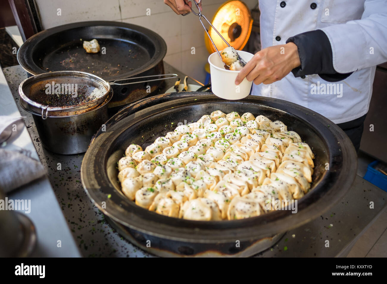 Sheng Jian Bao and Guo Tie being packaged - Shanghai pan fried ...