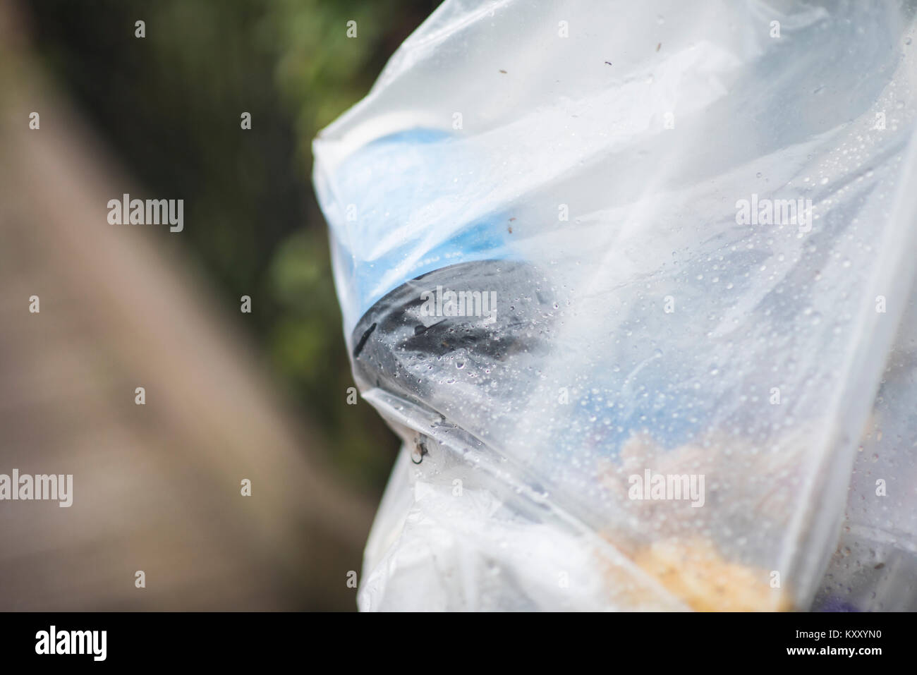 Full plastic trash bag hi-res stock photography and images - Alamy