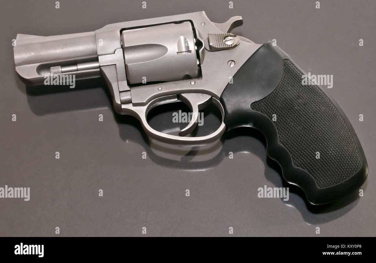 A 44spl stainless steel revolver with a black handle laying upon a ...