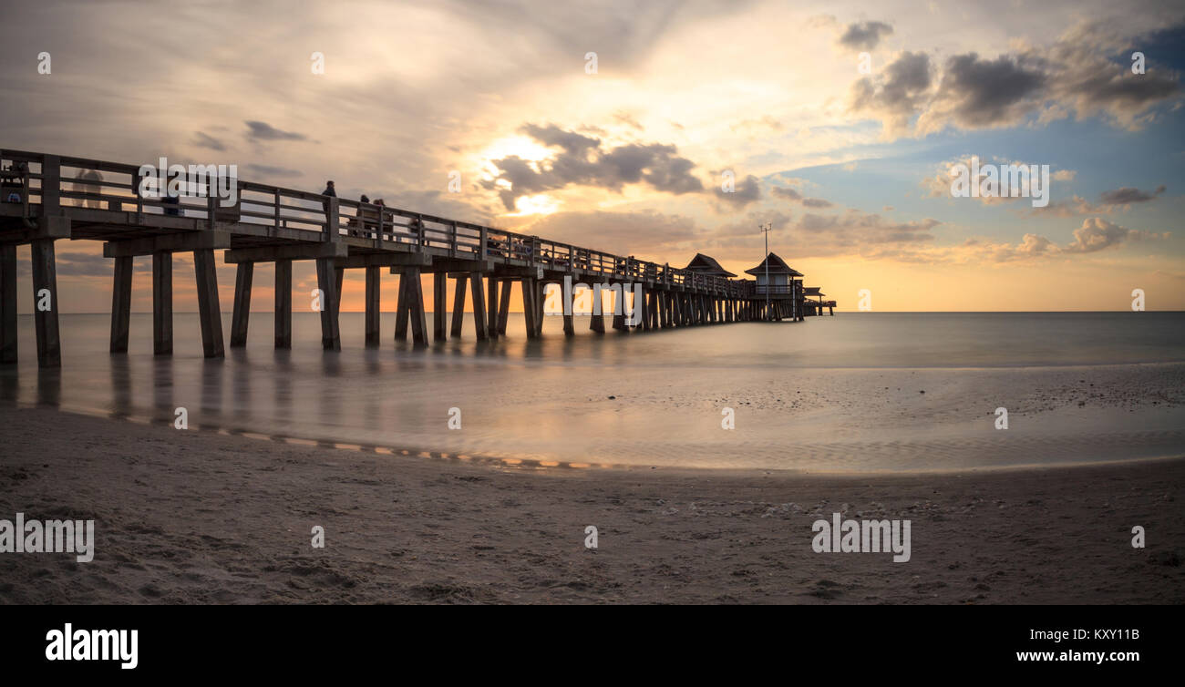 Naples Pier on the beach at sunset in Naples, Florida, USA Stock Photo ...