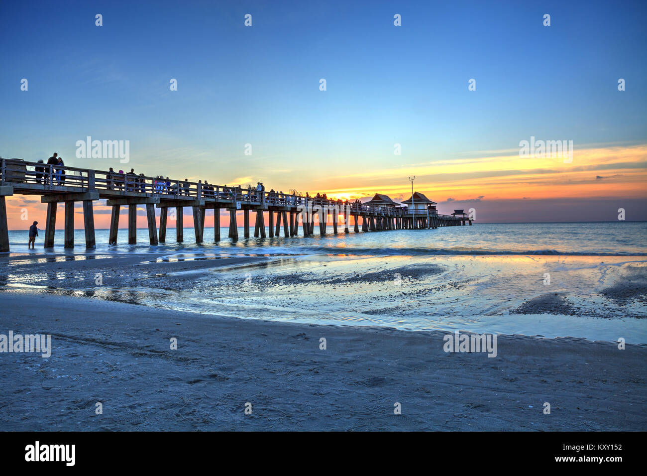 Naples Pier on the beach at sunset in Naples, Florida, USA Stock Photo ...