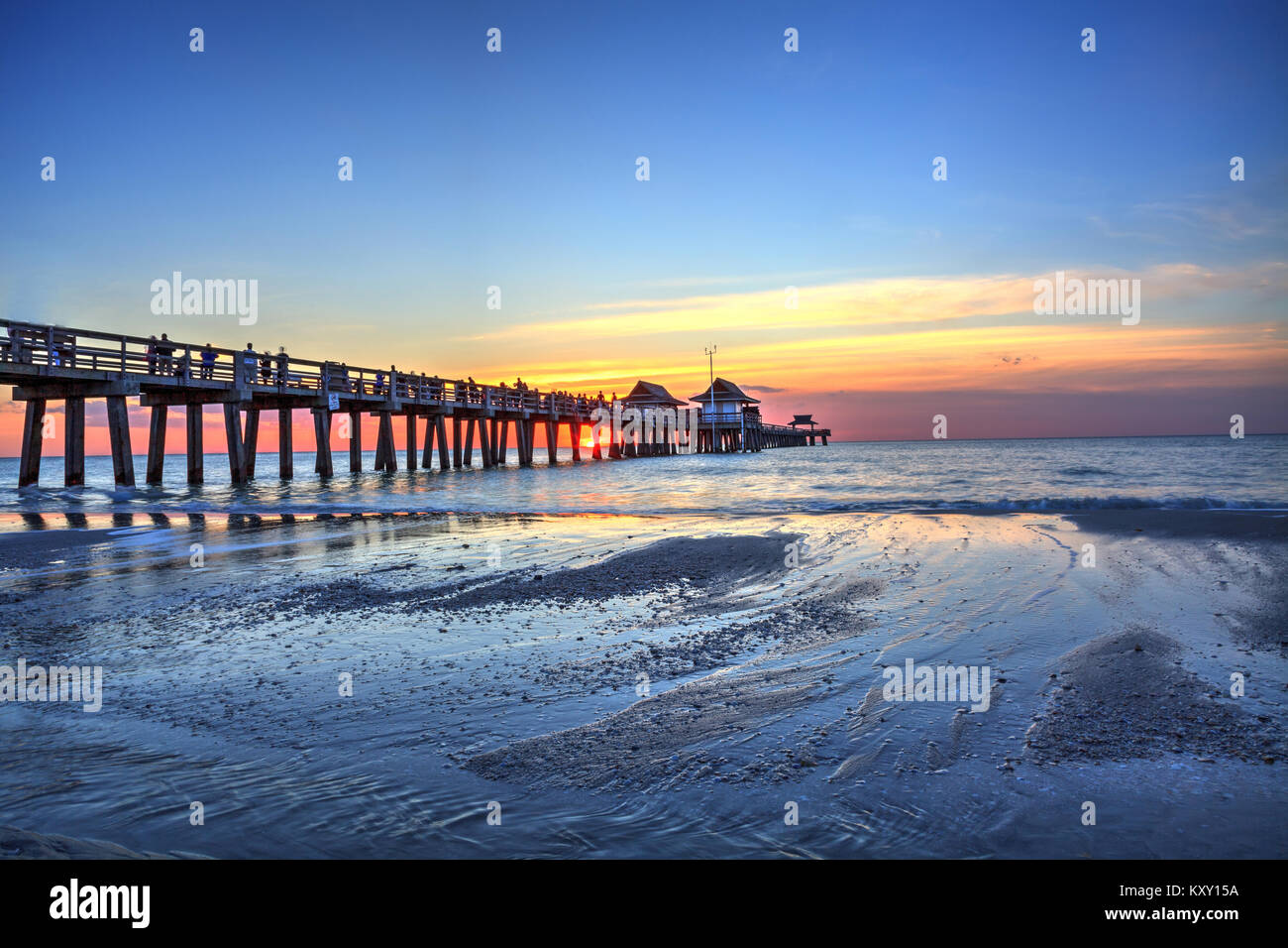 Naples Pier on the beach at sunset in Naples, Florida, USA Stock Photo ...