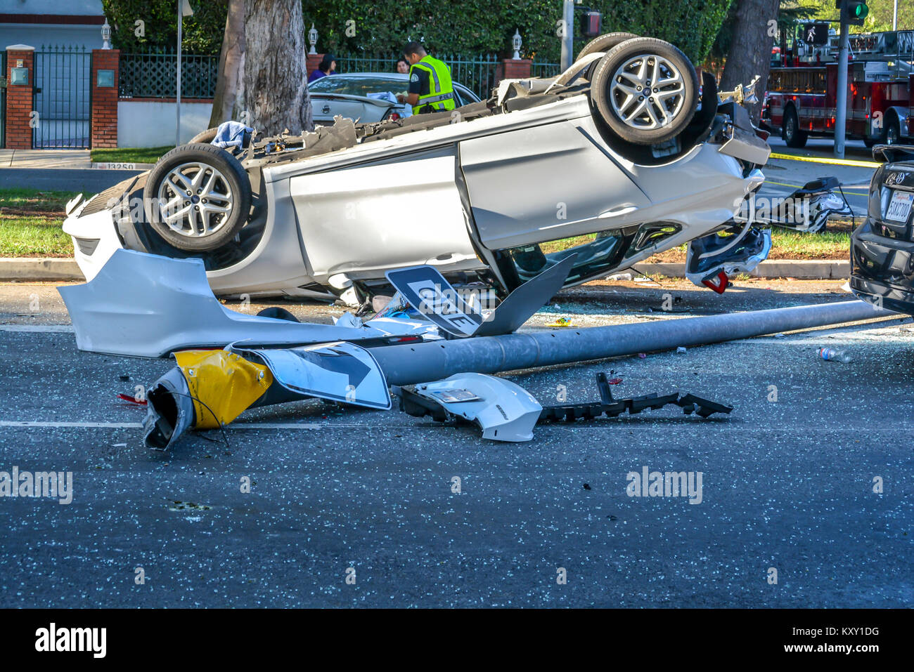 Overturned car with traffice sign down at motor accident Stock Photo ...