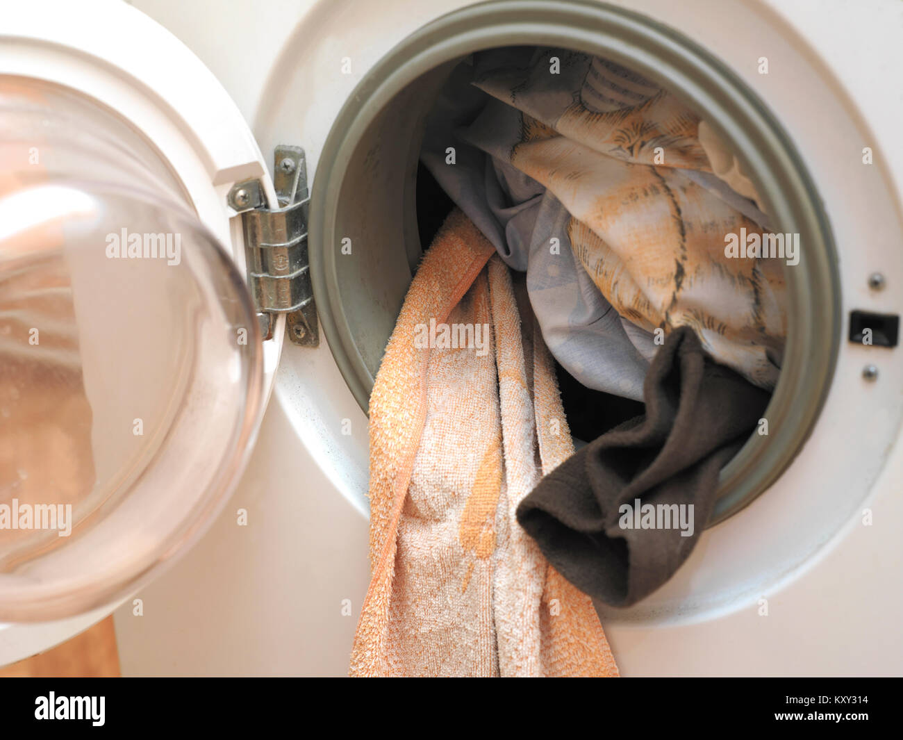 Open door of a washing machine with clean laundry Stock Photo - Alamy
