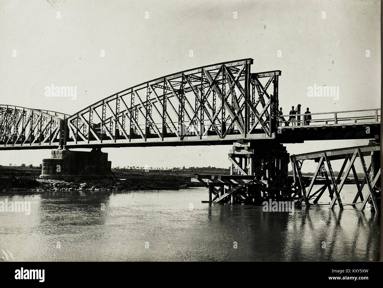 This photograph depicts a destroyed bridge near Stryj, part of the ...