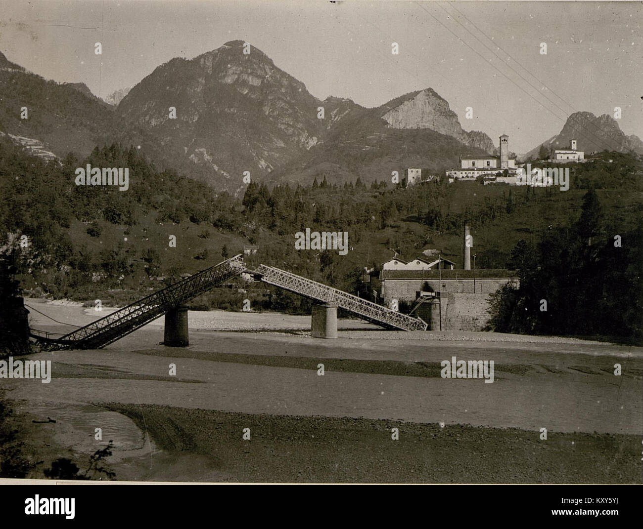 A photograph depicting a demolished bridge over the Fella River near ...