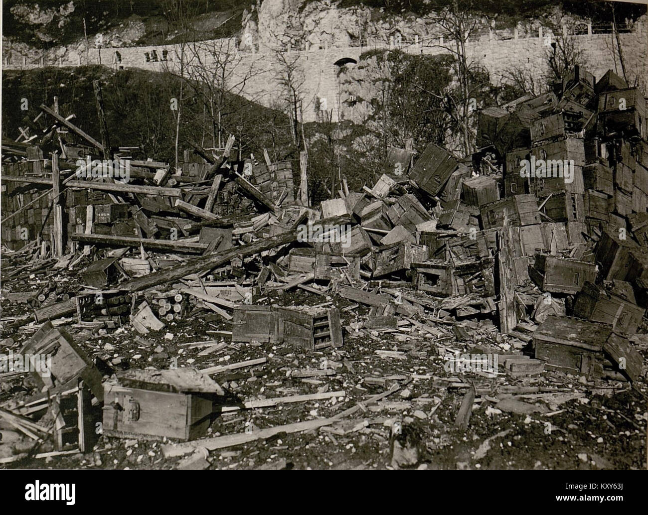 The image depicts a destroyed Italian munitions depot at the ...