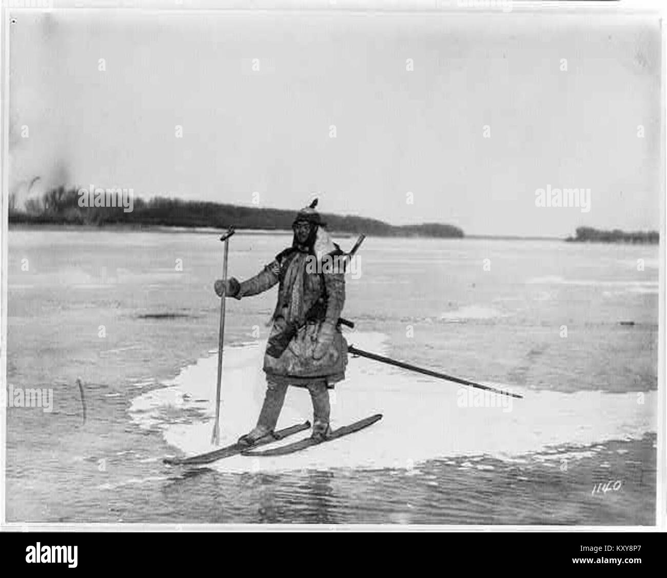 The image depicts a hunter on skis, standing on an ice floe in the ...