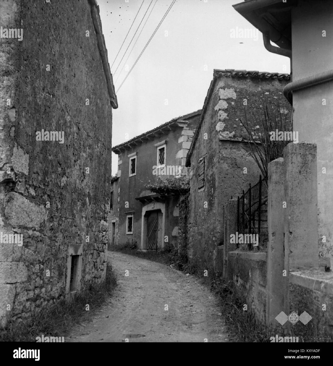 This photograph taken in 1969 captures a street scene from Grize ...