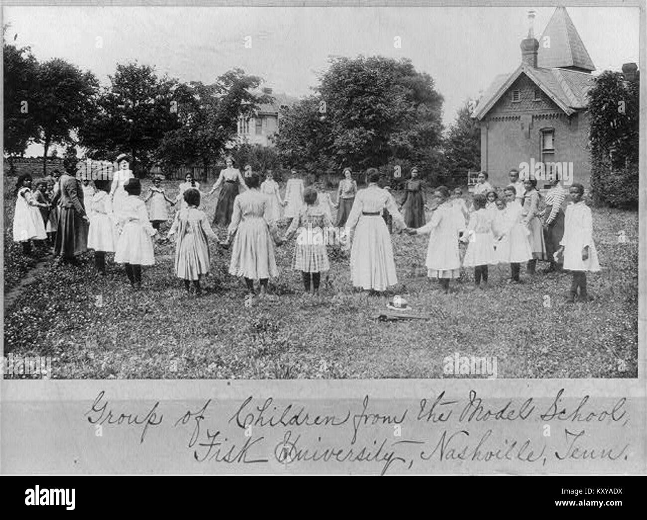 A historical photograph showing children at the Model School of Fisk ...