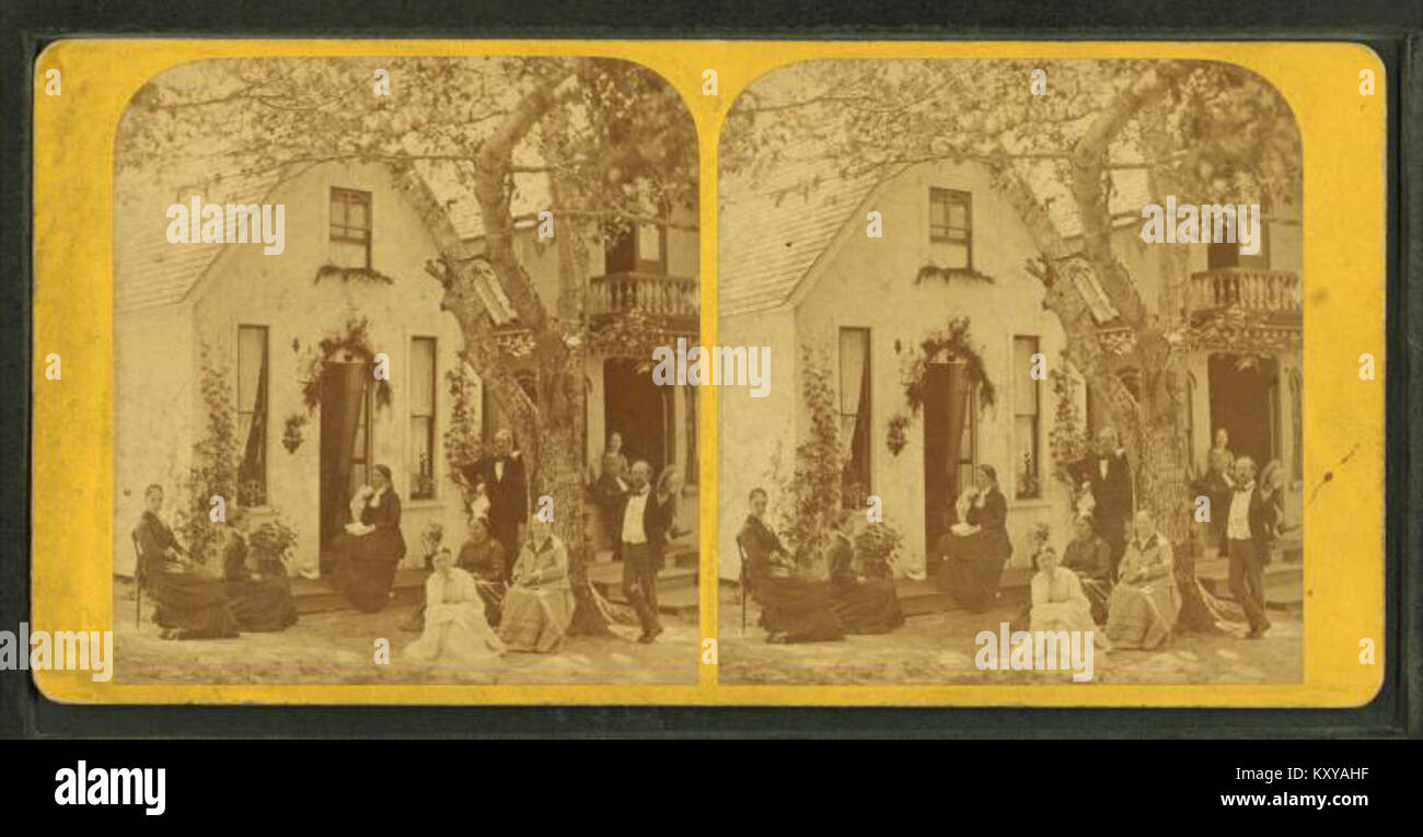 This historical photograph by S. F. Adams captures a group of people ...