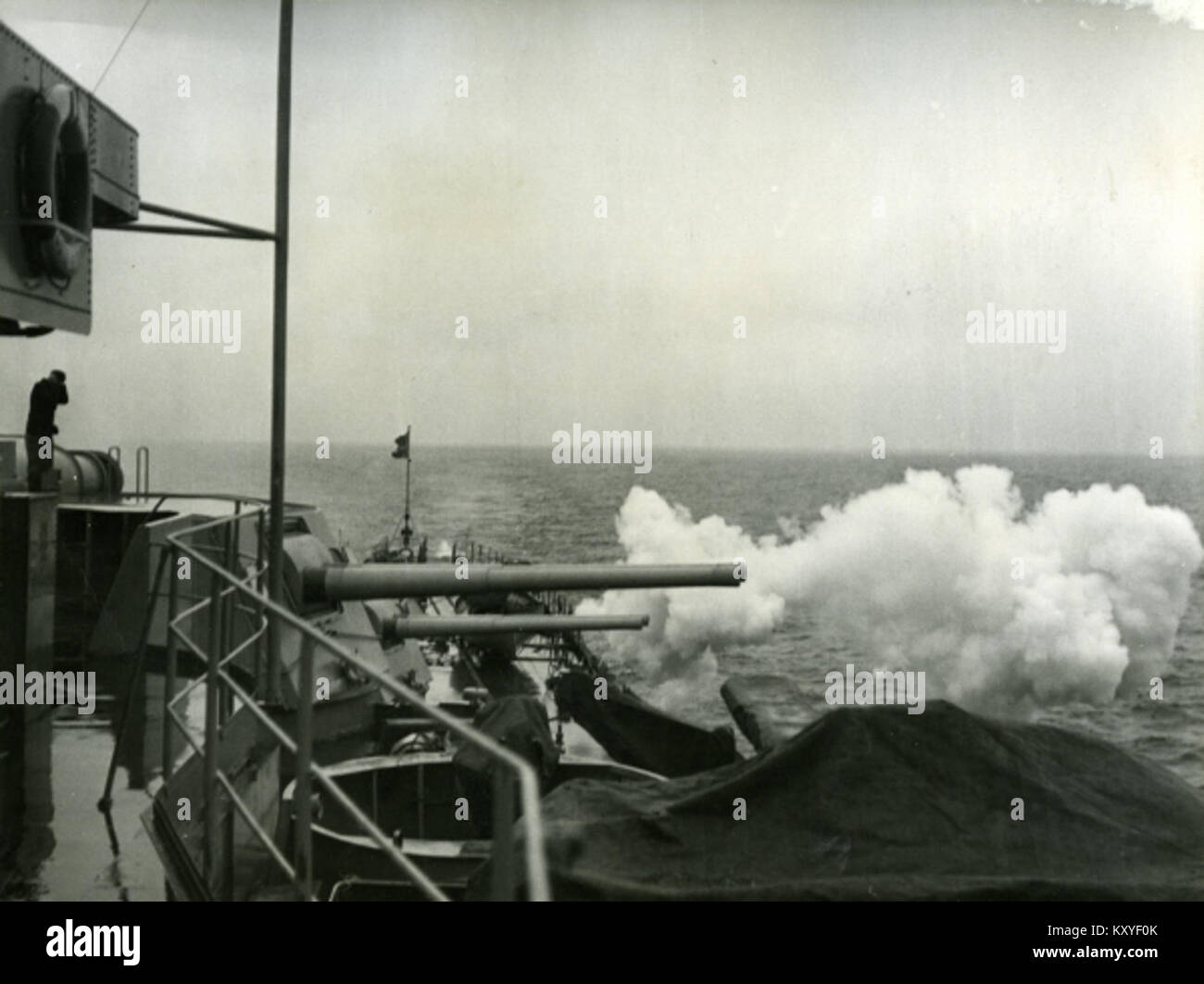 Photograph of the Swedish light cruiser HSwMS Göta Lejon firing its aft ...