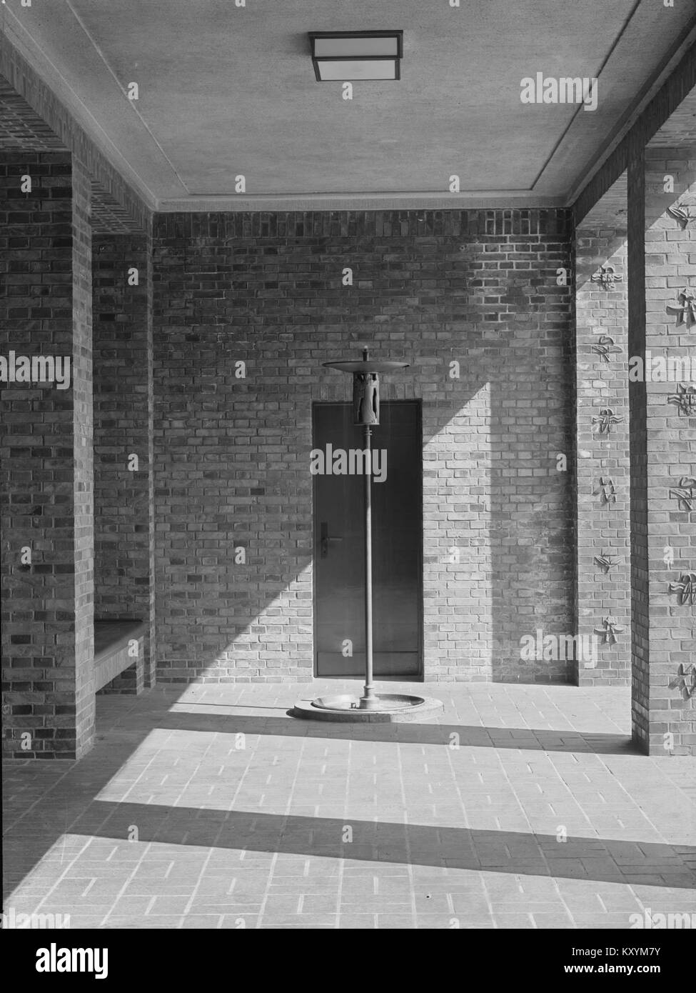 An image of the interior of a crematorium hall, designed with column ...