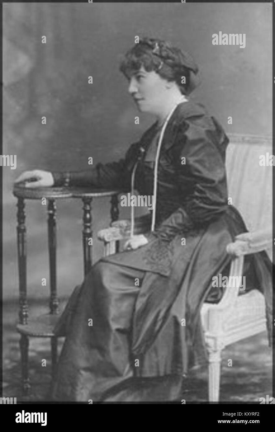 A portrait photograph of Polish writer Helena Mniszkówna seated on a ...