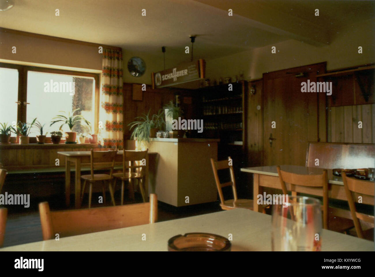 This photograph depicts the interior of a guesthouse (Gaststätte) in ...