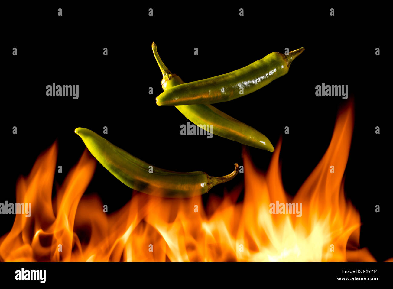 hot pepper with fire on a black background Stock Photo - Alamy