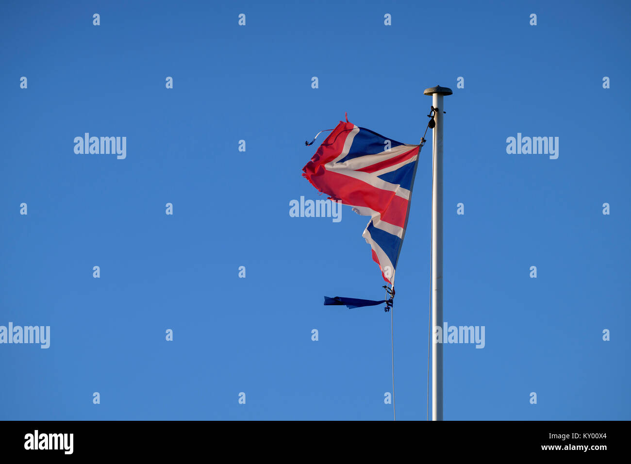 Union jack flag against blue sky hi-res stock photography and images ...