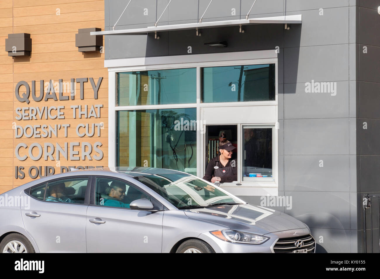 Grand opening Wendy's restaurant pickup window with employee servicing ...