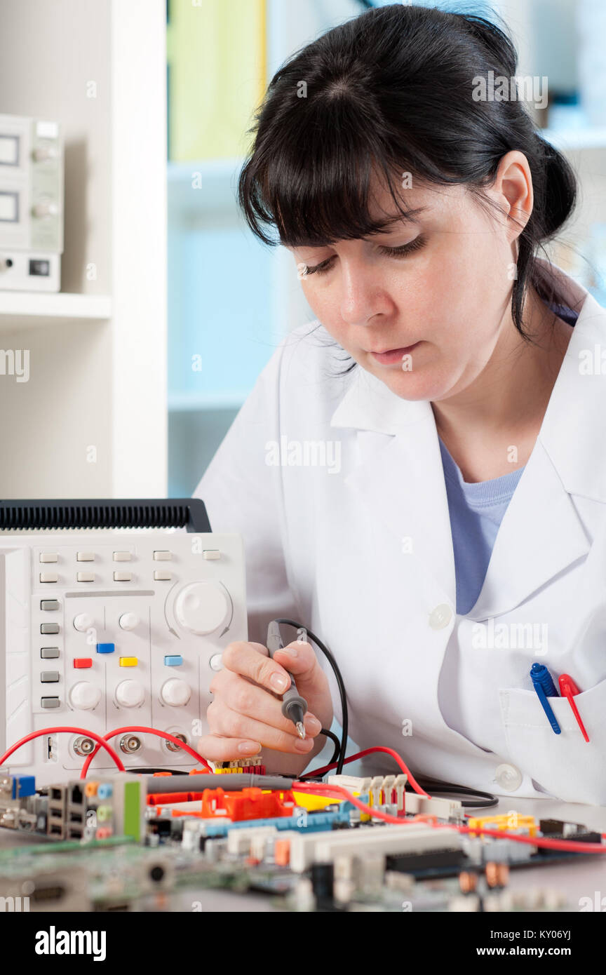 Electronics tech tests a surcuit board Stock Photo - Alamy