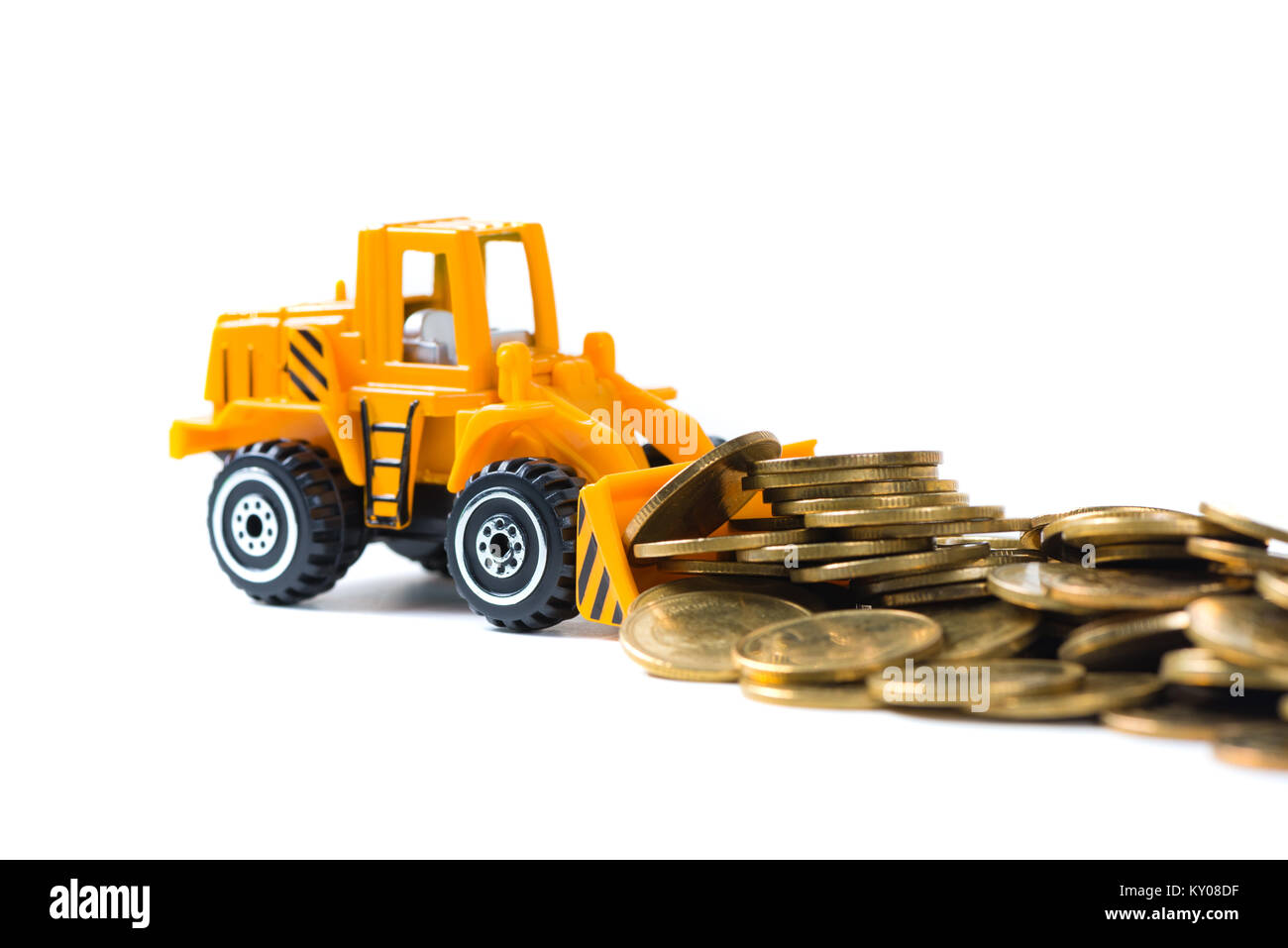 Mini bulldozer truck loading stack coin with pile of gold coin ...