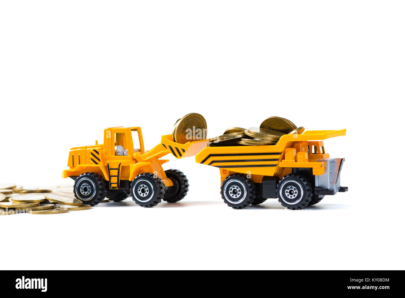 Mini bulldozer truck loading stack coin with pile of gold coin ...