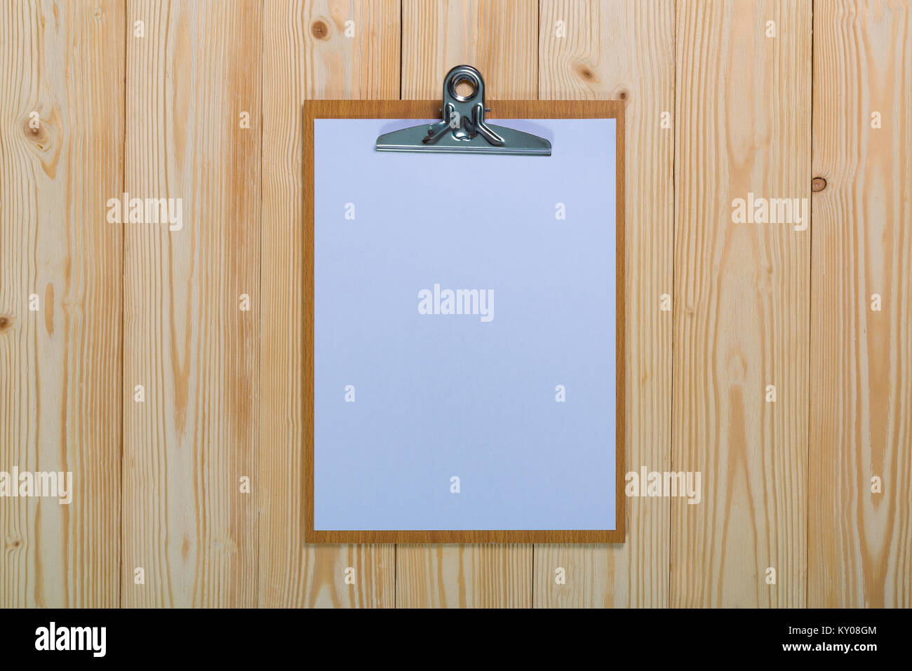 clipboard with blank white paper sheet on wood table top view with copy ...