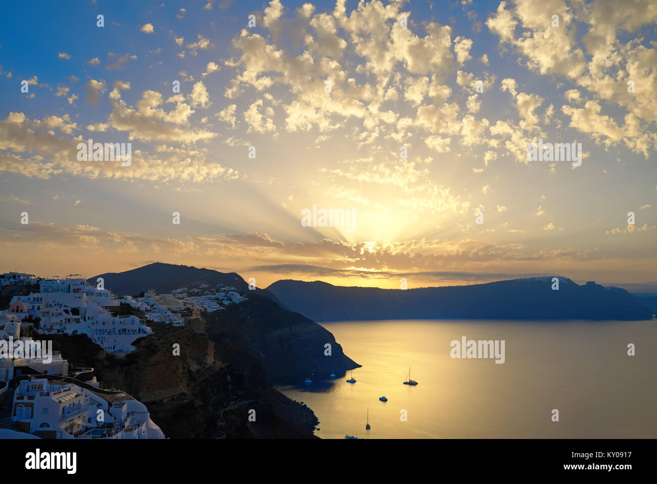 Oia village, sunrise over famous volcanic caldera. Santorini island ...