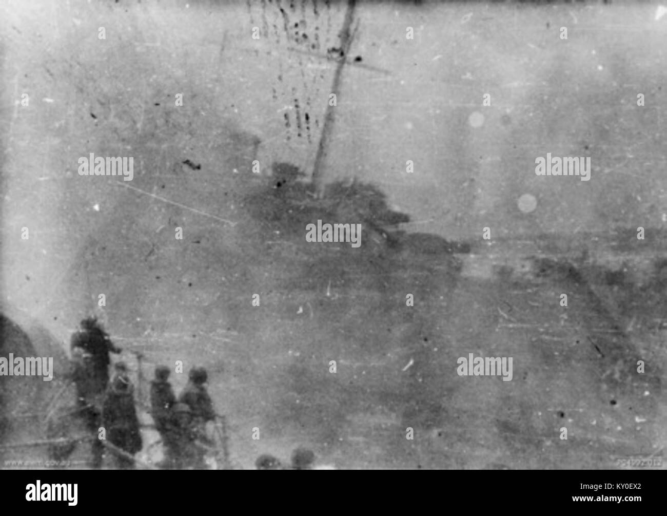 A 1942 photograph showing the burning bow of HMAS Canberra (D33) after ...