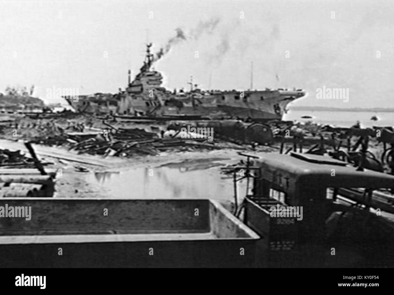 The HMS Glory (R62), a British aircraft carrier, is shown in Balikpapan ...
