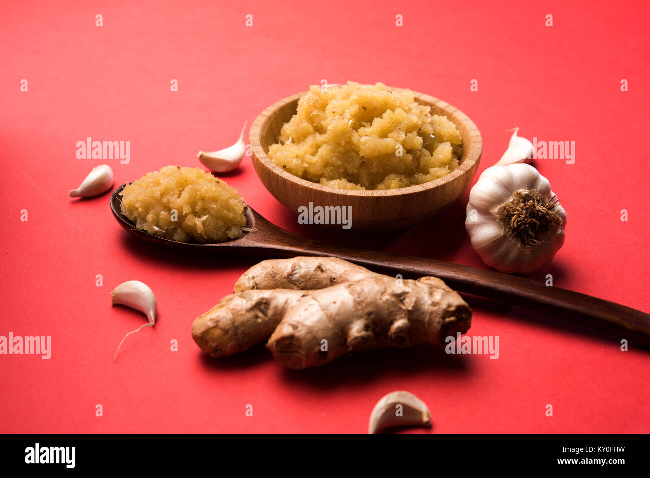 Fresh mashed Ginger puree / Adrak paste in white bowl with raw whole ...