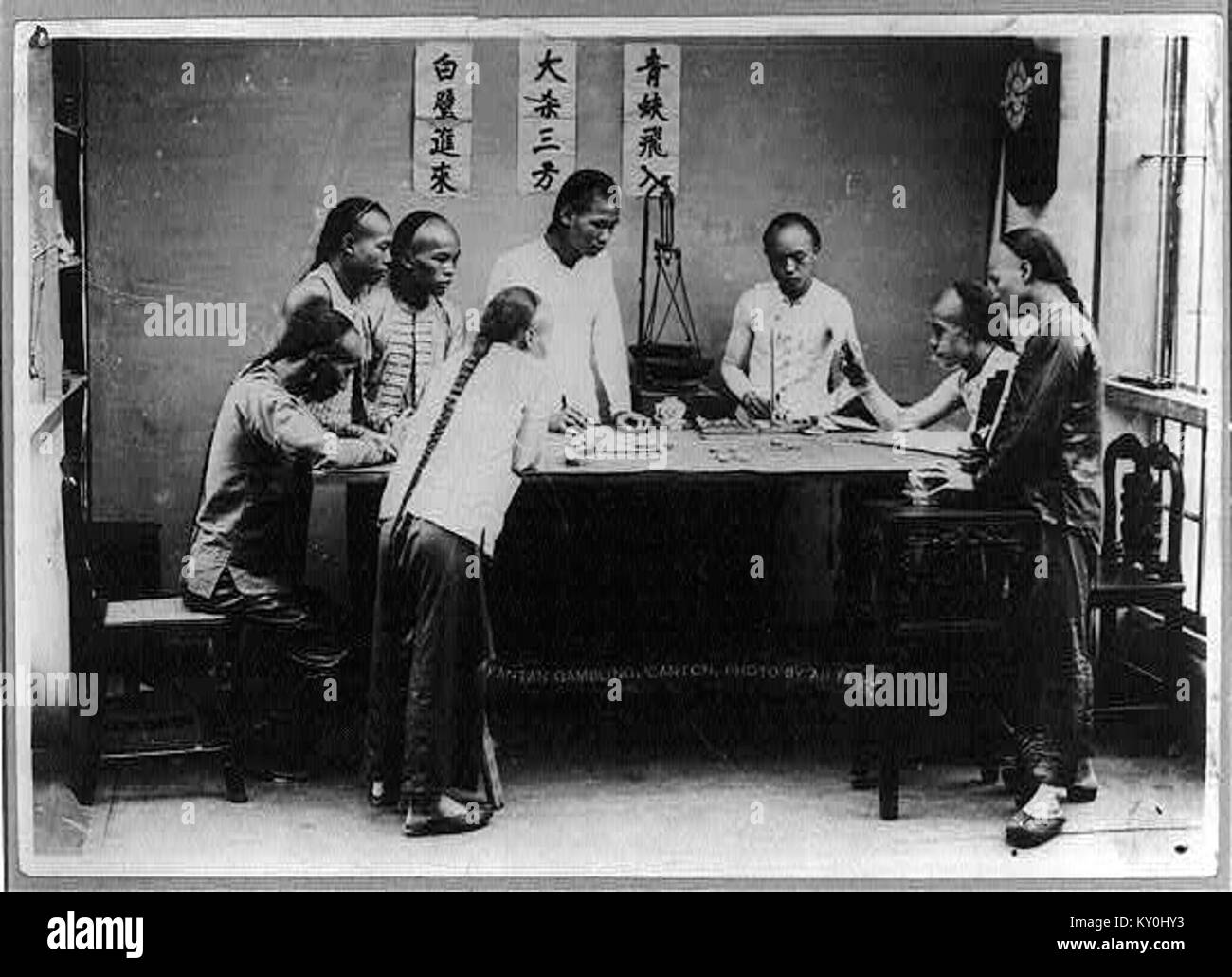 An image depicting a game of Fantan, a traditional Chinese gambling ...