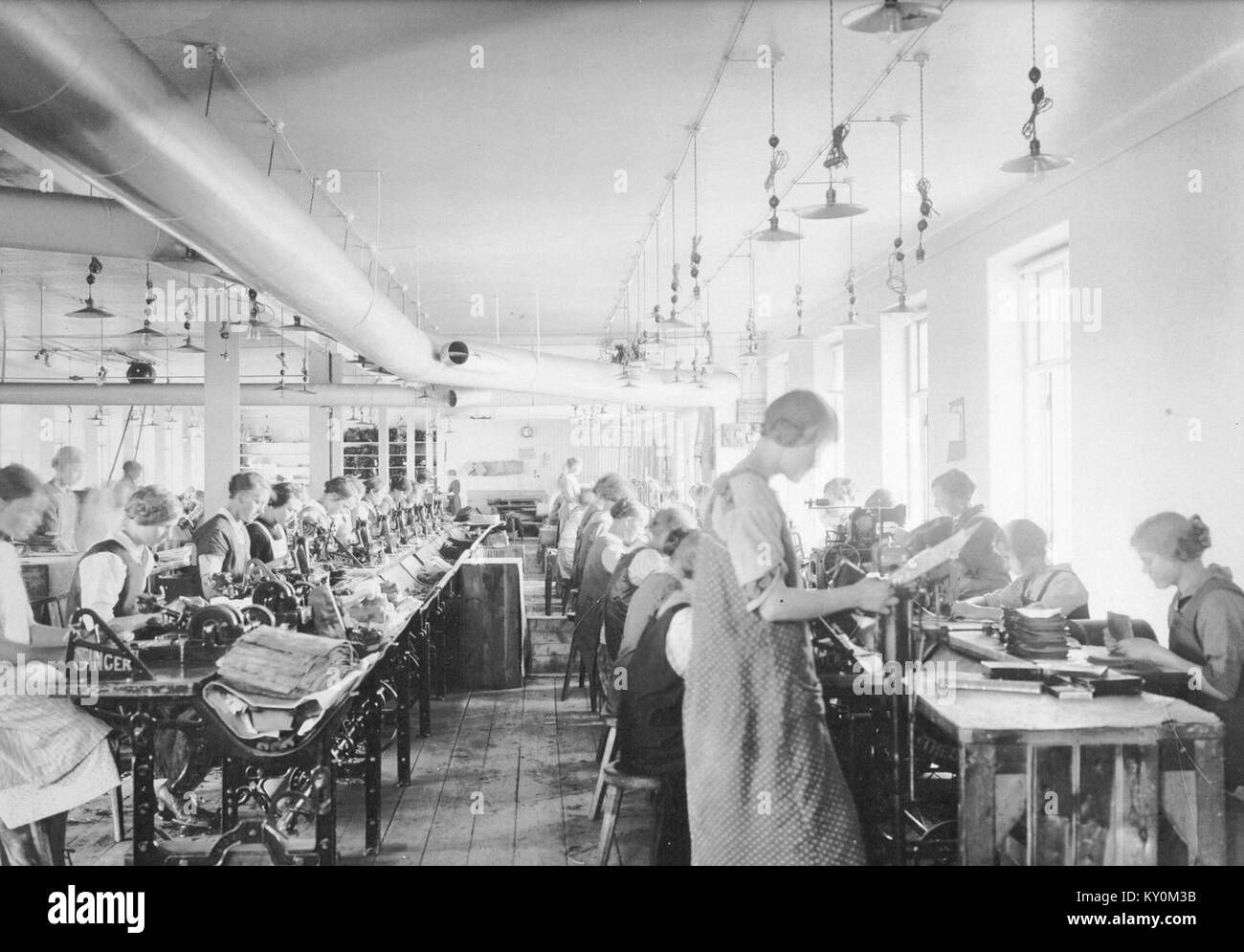 This historical image depicts the Hösten shoe factory in Uppsala ...