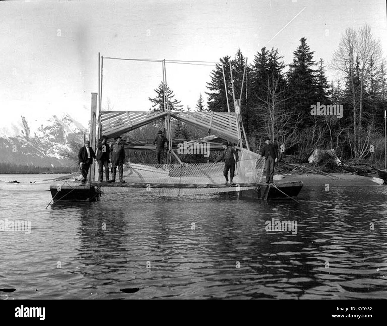 A historical photograph capturing a fishwheel on the Taku River in ...