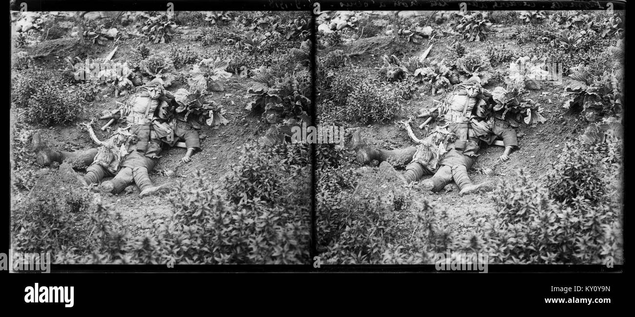 This photograph from September 18, 1918, shows bodies in a shell hole ...