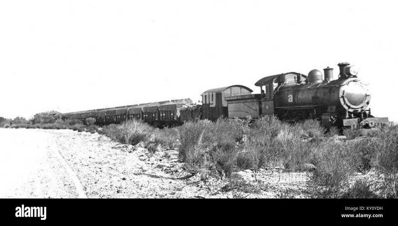 An E-class freight train transporting bulk wheat in 1931, highlighting railway operations and ...