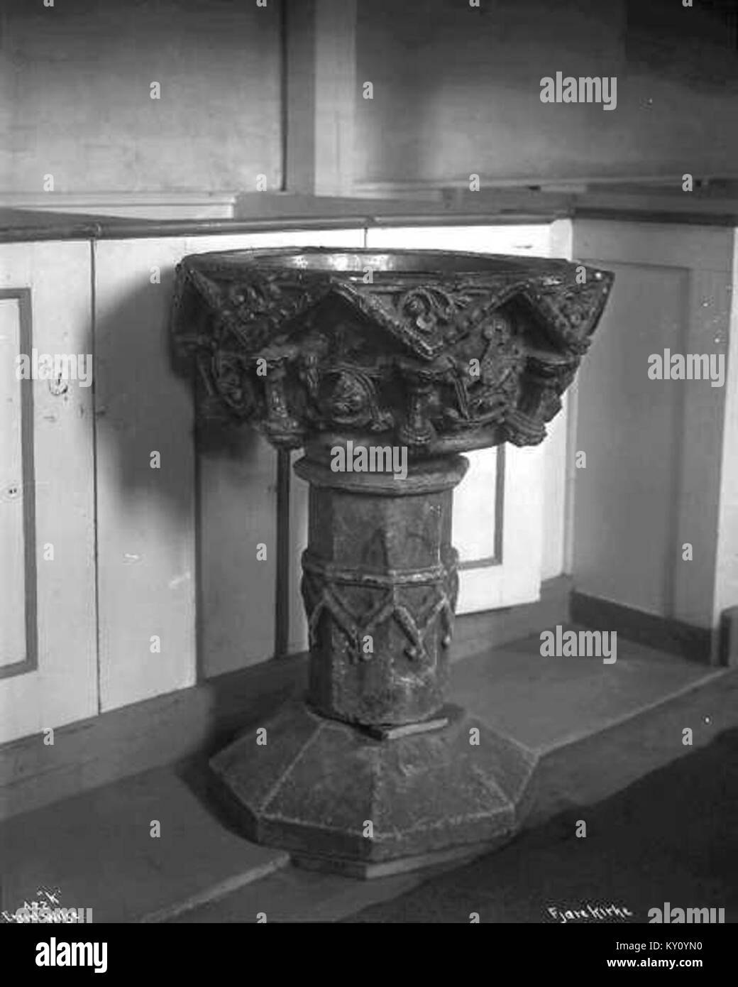 A 1912 photograph by Anders Beer Wilse showing the baptismal font of ...