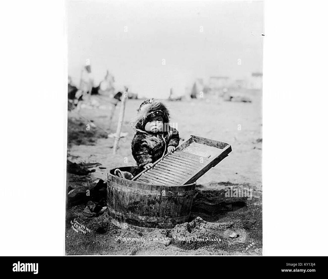 Eskimo child with wooden tub and washboard, ca 1905 (NOWELL 167 Stock ...