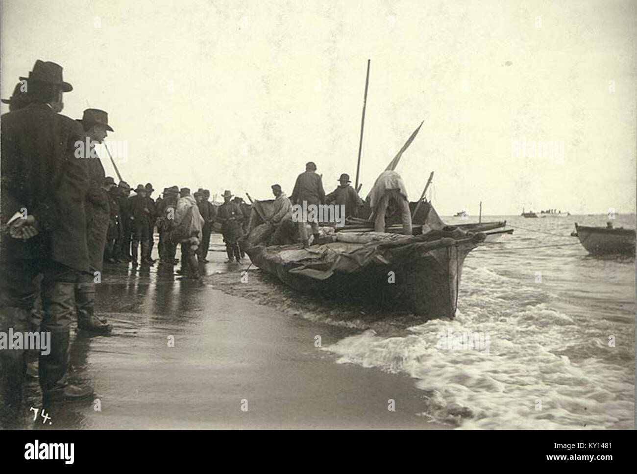 Historical photograph of Indigenous people in Nome, Alaska, unloading ...