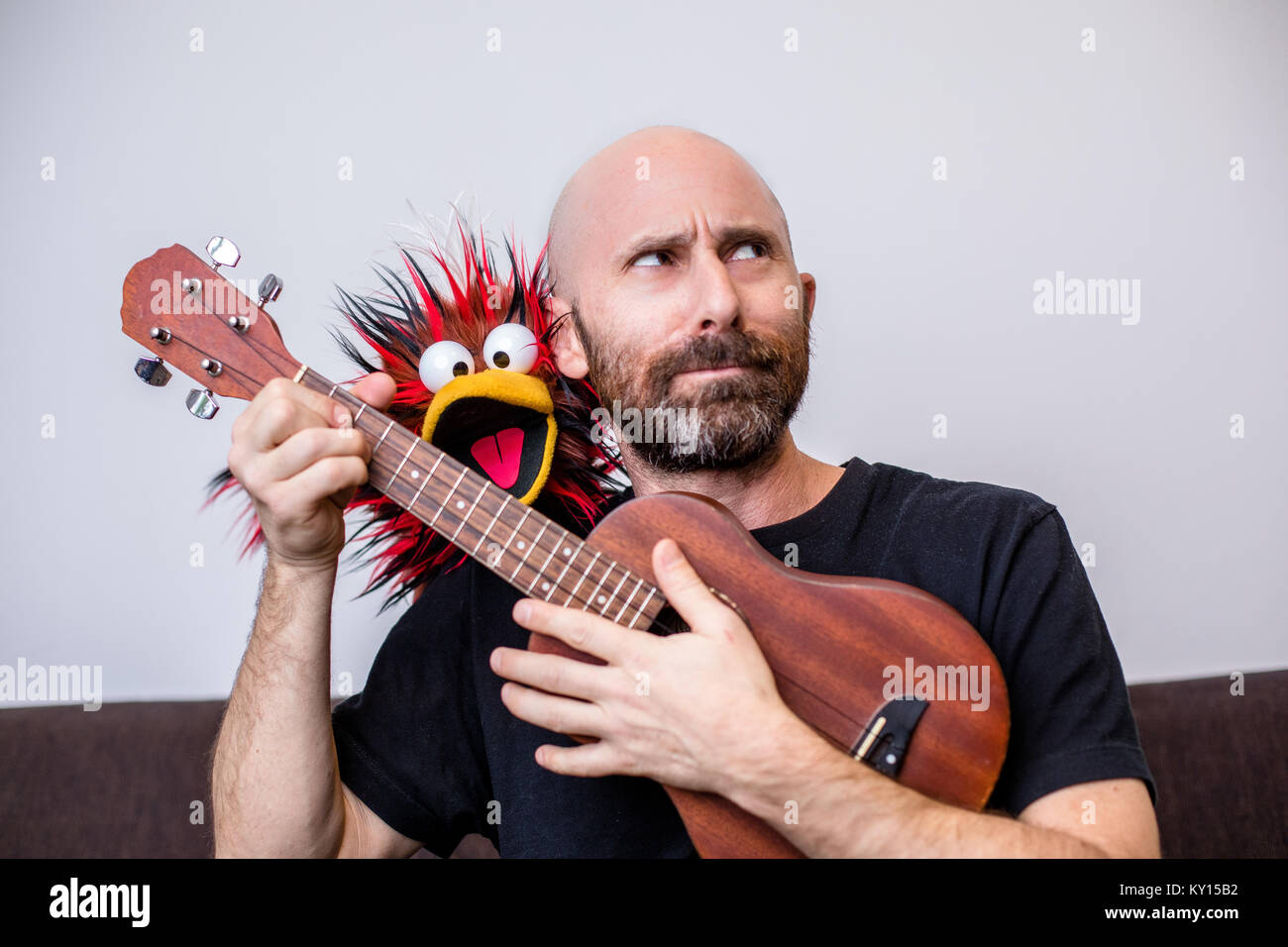 PORTRAIT OF SCHULTZ THE PUPPET AND BALD CAUCASIAN MAN WITH BEARD ...